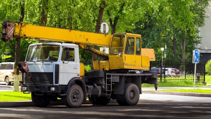 Auto crane on the road stock image. Image of machine - 83003191