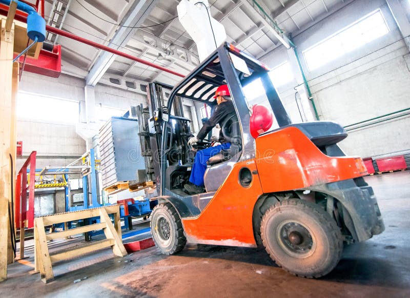 Auto Loader with Concrete Blocks in the Warehouse Factory Stock Photo ...