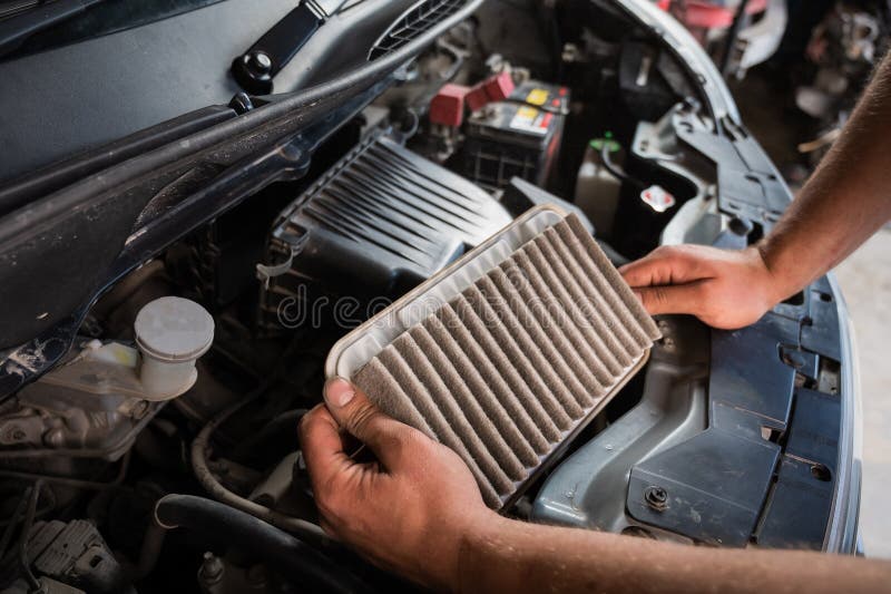 An Auto Mechanic is Changing the Air Filter in the Car Stock Image ...