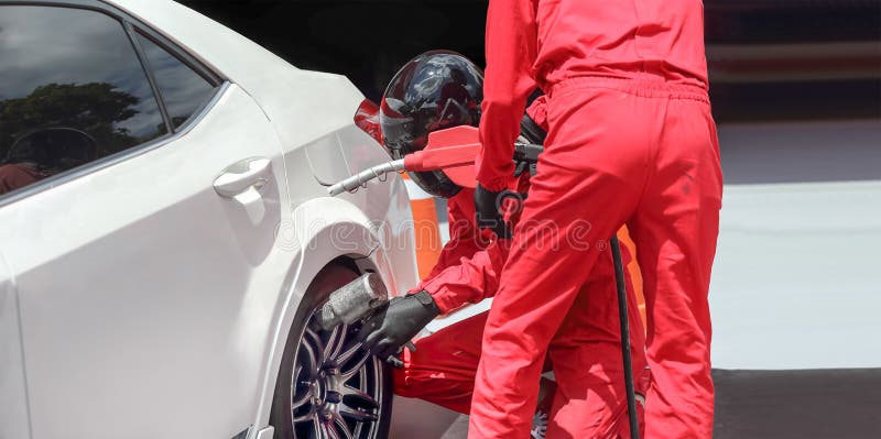 Auto Mechanic Changing Racing Car Wheel Stock Photo - Image of change ...