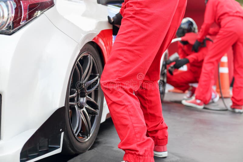 Auto Mechanic Changing Racing Car Wheel Stock Photo - Image of ...