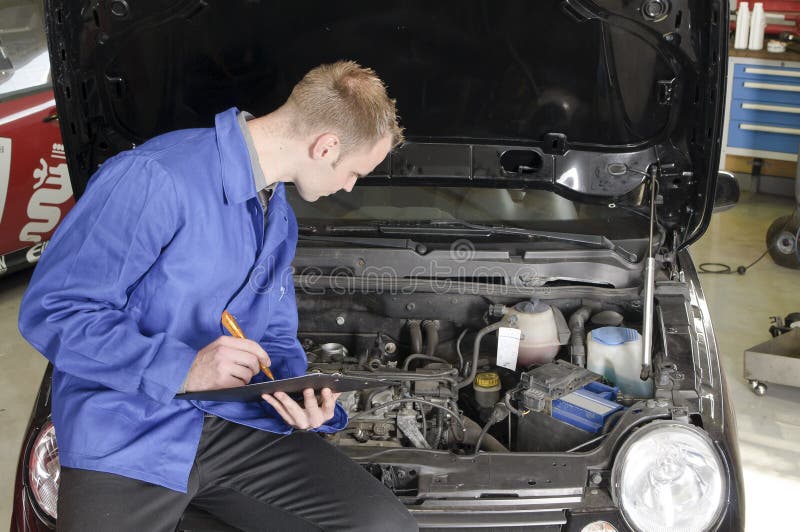 Auto mechanic check a car stock photo. Image of auto - 19736386