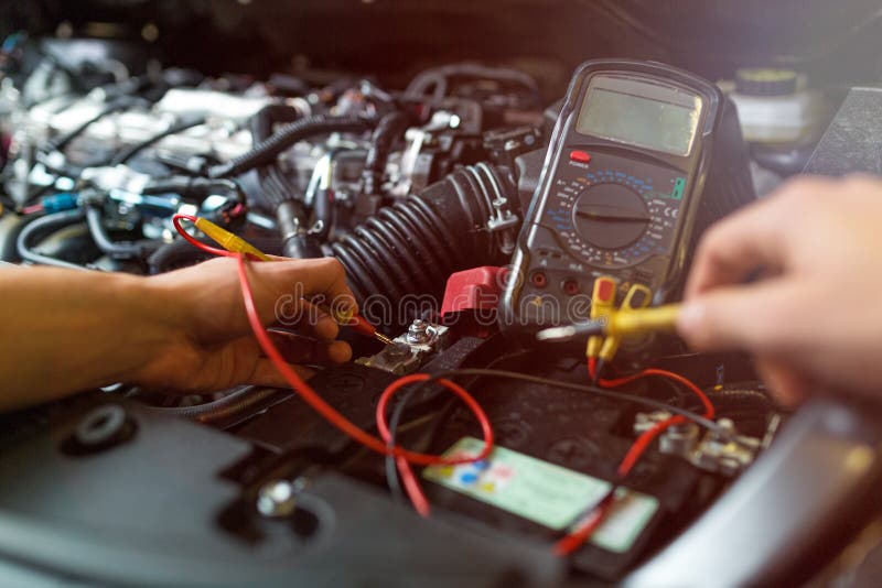 Auto Mechanic Checking Car Battery Voltage Stock Photo - Image of ...