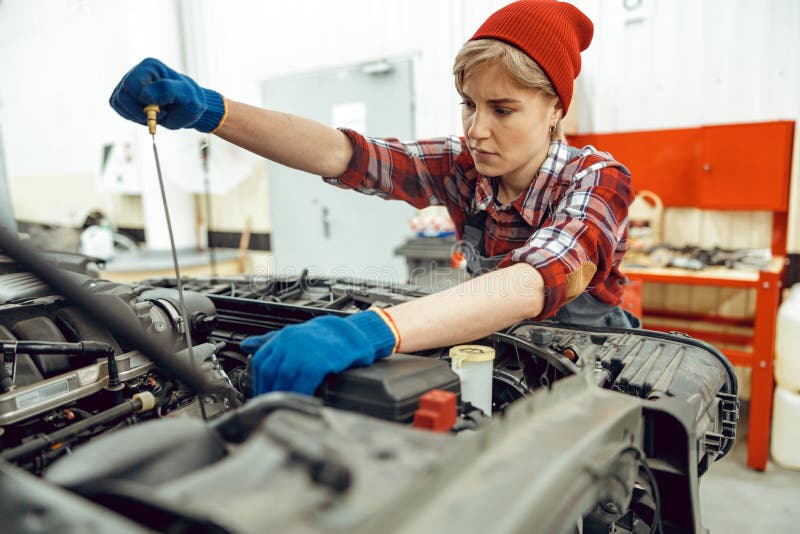 Auto Mechanic Checking the Engine Oil Level Stock Photo - Image of ... Auto Mechanic Checking the Engine Oil Level Stock Photo - Image of ...