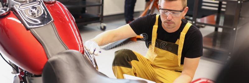 Auto Mechanic Checks Technical Condition of Motorcycle in Workshop ...