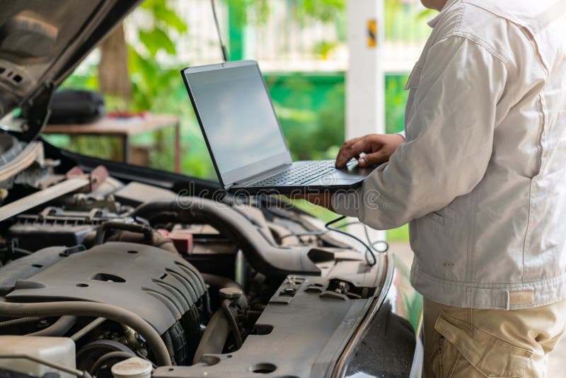 Auto Mechanic Diagnosing Car with Computer Setting Stock Photo - Image ...