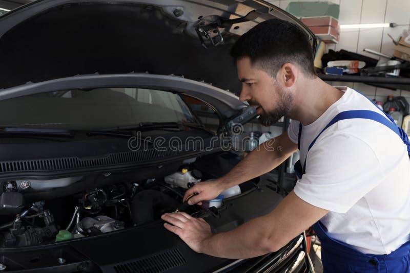 Auto Mechanic Fixing Modern Car in Service Center Stock Photo - Image ...