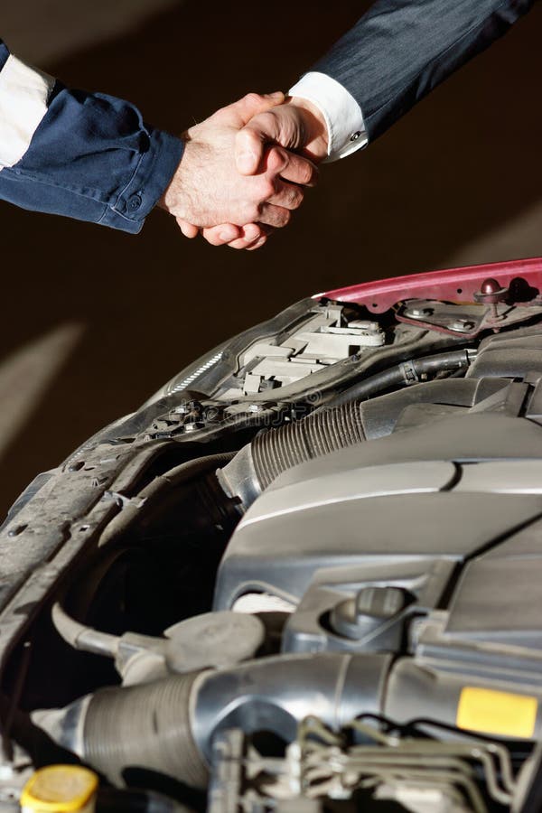 Auto mechanic handshake stock photo. Image of roadside - 76680226