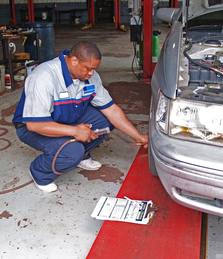Mechanic Performing A Routine Service Inspection Stock Photo - Image of ...
