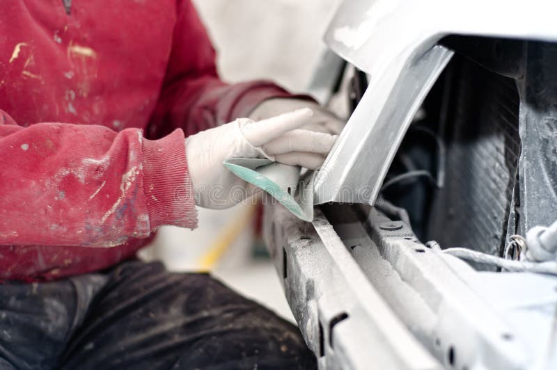 Auto Mechanic Prepairing the Front Bumper of a Car Stock Photo - Image ...