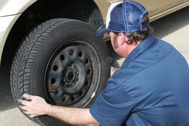 Auto Mechanic Removing Tire Stock Photo - Image of mechanical, service ...