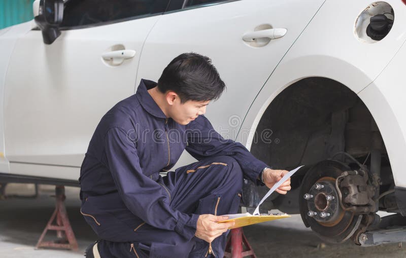 Auto Mechanic Repairman with a Checklist, Technician Checking Modern ...