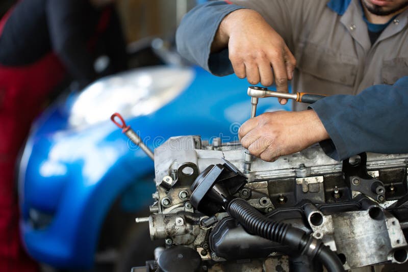 An Auto Mechanic Repairs an Internal Combustion Engine Stock Photo ...