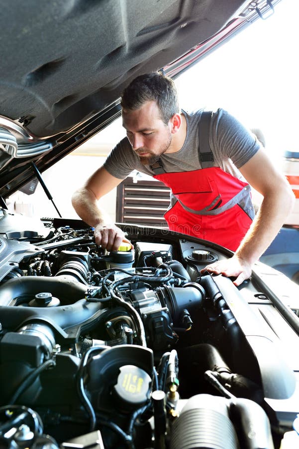 Auto Mechanic Repairs Vehicle in a Workshop Stock Image - Image of ...