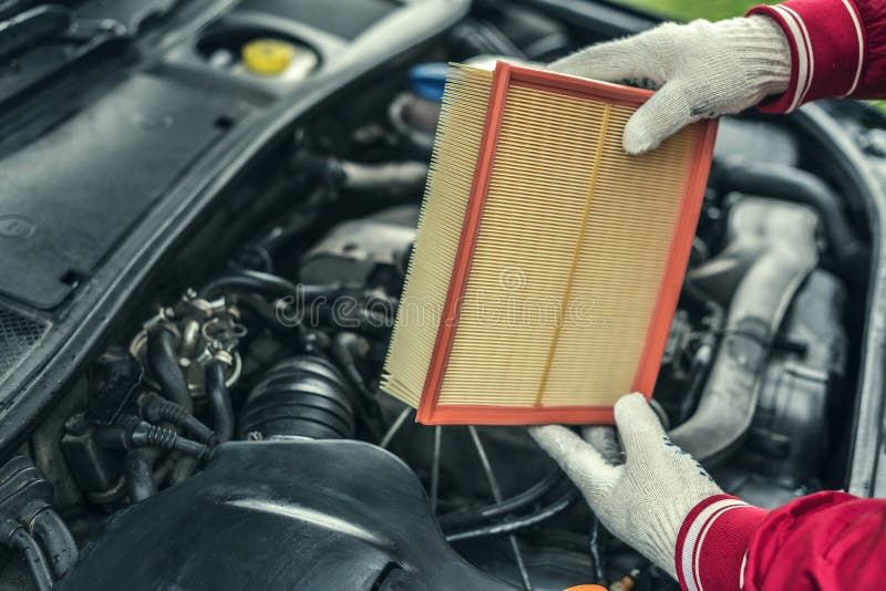 The Auto Mechanic Replaces the Car`s Air Filter. Stock Photo - Image of ...