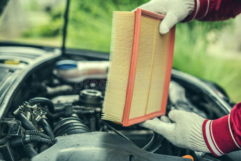 The Auto Mechanic Replaces the Car`s Air Filter. Stock Photo - Image of ...