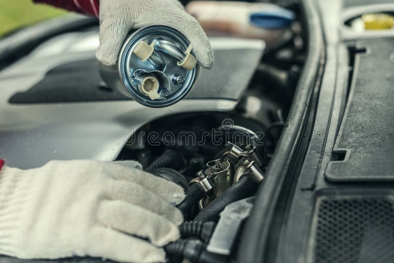 An Auto Mechanic Replaces a Car`s Fuel Filter. Stock Image - Image of ...