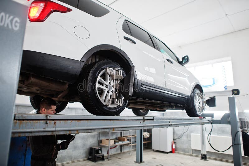 Auto Mechanic Sets American SUV Car for Diagnostics and Configuration ...