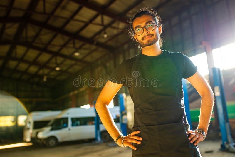 Auto Mechanic Standing in His Workshop in Sunset Light Background Stock ...