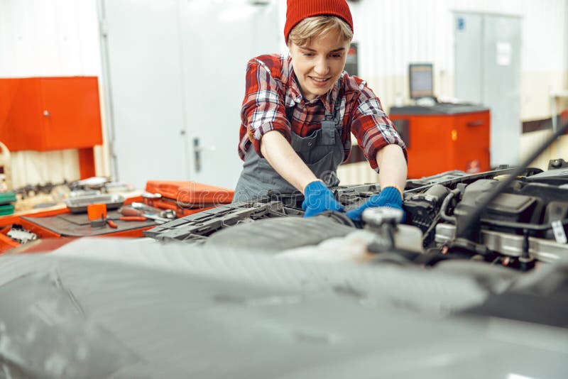 Auto Mechanic Testing a Car Coolant Hose Stock Photo - Image of lady ...