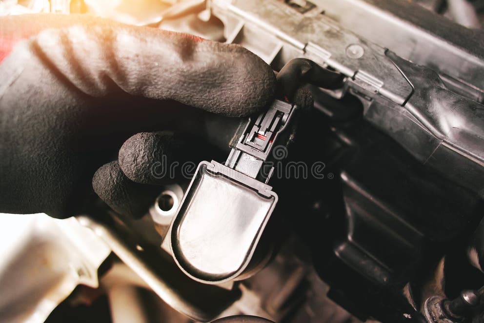 The Auto Mechanic is Unplugging the Ignition Coil Stock Image - Image ...
