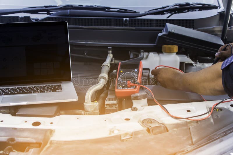 Auto Mechanic Uses a Multimeter Voltmeter. Stock Image - Image of adult ...