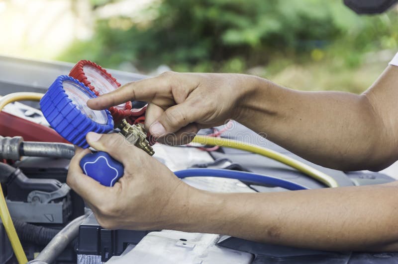 Auto Mechanic Uses a Pressure Gauge on the Air Compressor,liquid Air ...
