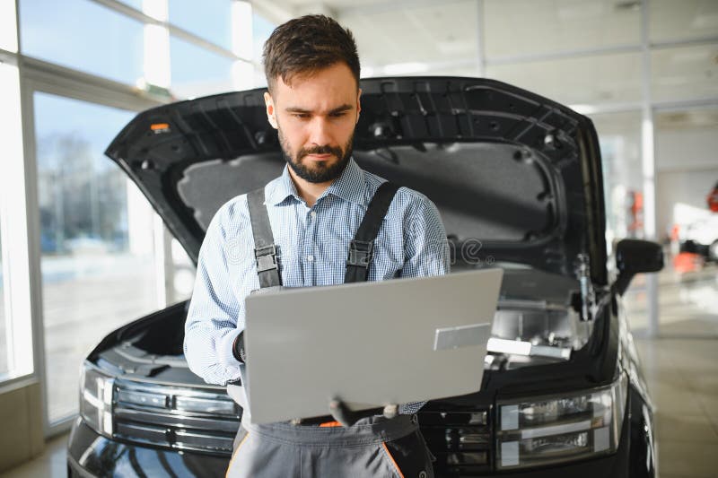 Mechanic Using Compute for Diagnostic Machine Tools Ready To Be Used ...