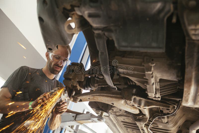 Auto Mechanic at Work stock image. Image of maintenance - 65248893