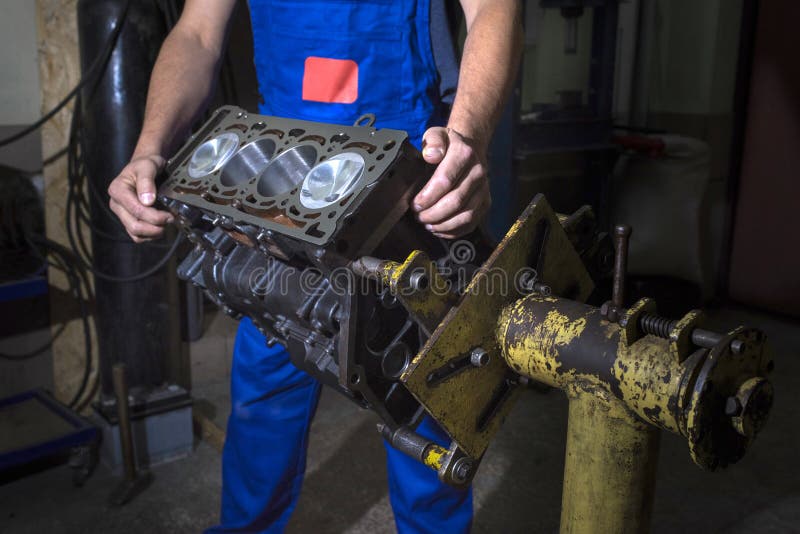 Auto Mechanic Working on a Car Engine in a Garage. Repair Service Stock ...