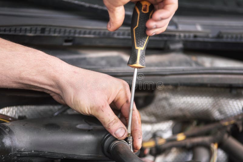 Auto Mechanic Working on Car Engine at Repair Service. Close Up View ...