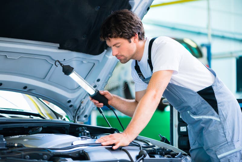 Mechanic Team Working in Car Workshop Stock Image - Image of team ...