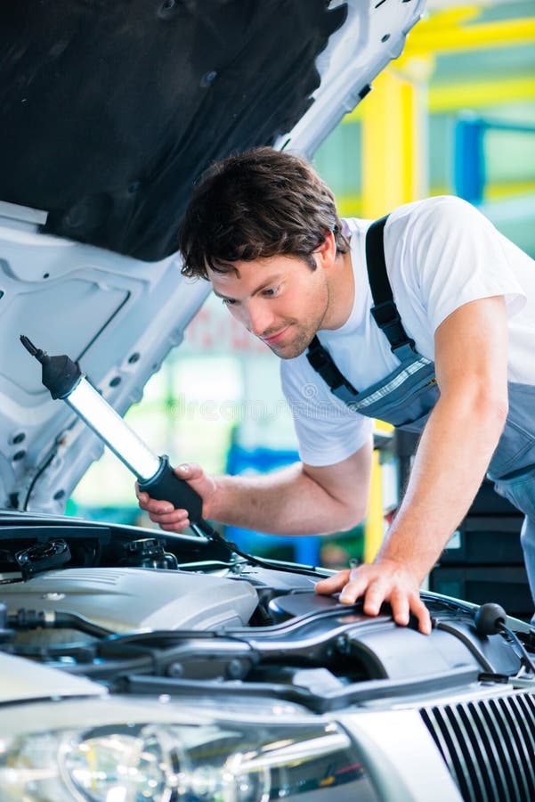 Mechanic Team Working in Car Workshop Stock Image - Image of team ...