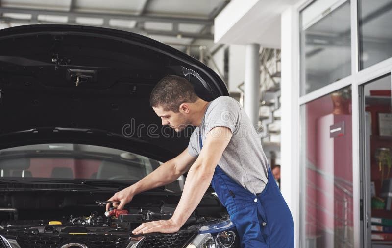 Auto Mechanic Working in Garage. Repair Service Stock Image - Image of ...