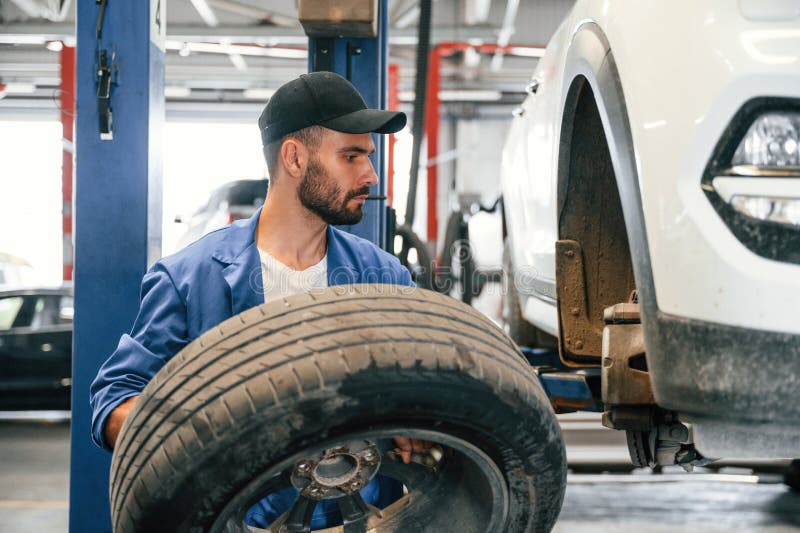 Auto Mechanic Working in Garage. Repair Service Stock Photo - Image of ...