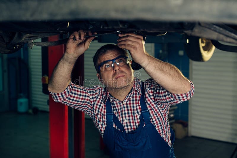 Auto Mechanic Working in Garage. Repair Service Stock Image - Image of ...