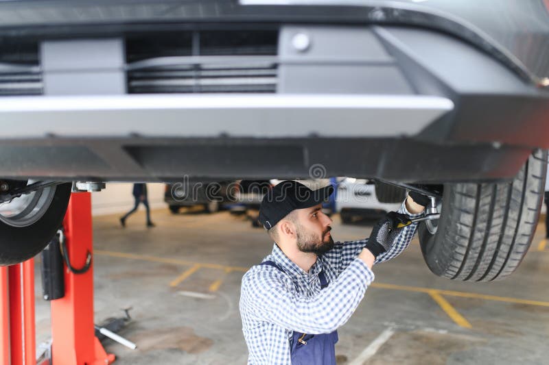Auto Mechanic Working at Auto Repair Shop Stock Image - Image of ...