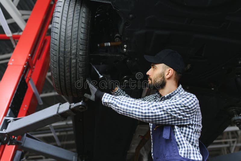 Auto Mechanic Working at Auto Repair Shop Stock Photo - Image of ...