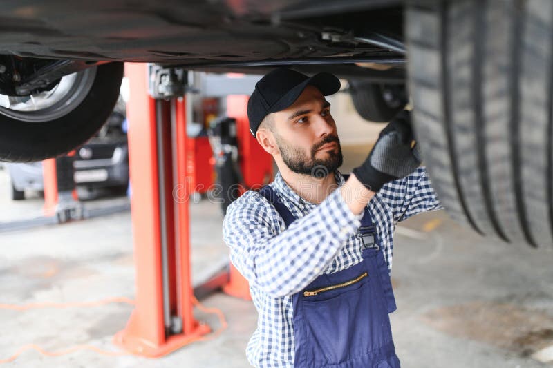 Auto Mechanic Working at Auto Repair Shop Stock Photo - Image of people ...
