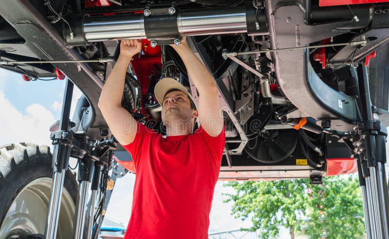 Mechanic Fixing Plow on the Tractor Stock Photo - Image of wrench ...