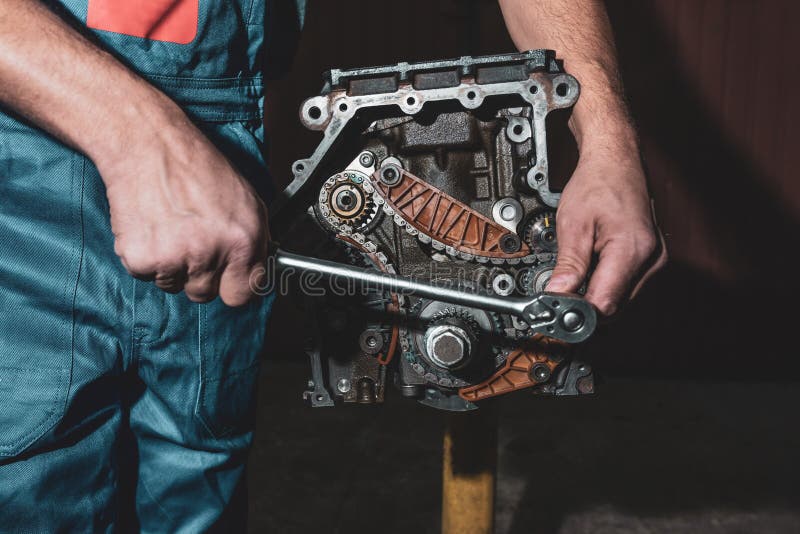 Auto Mechanic with a Wrench is Repairing a Car Engine Stock Photo ...