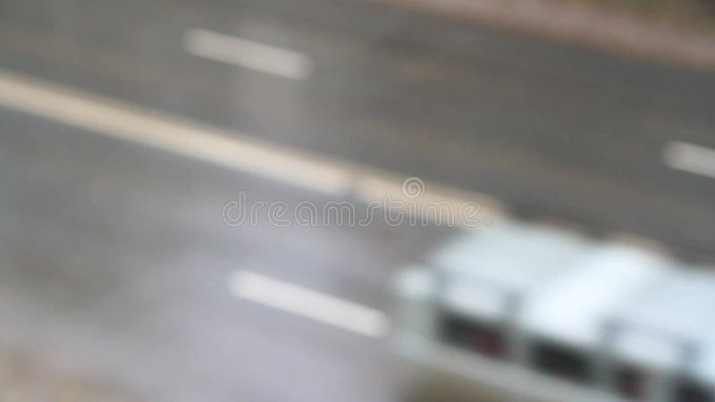 Auto Movement in Out of Focus. Transport Moves Along Road during Rain ...