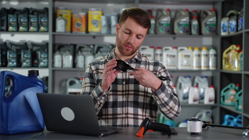 Auto Parts Seller Standing at Counter Checking Car Parts and Making ...