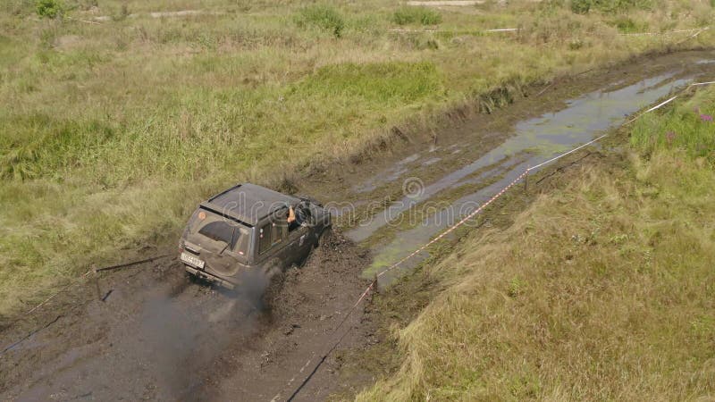 Auto racing in the mud. stock video. Video of drive - 199002803