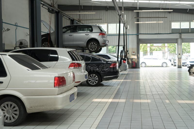 Professional Car Mechanics Working in Auto Repair Service Stations ...