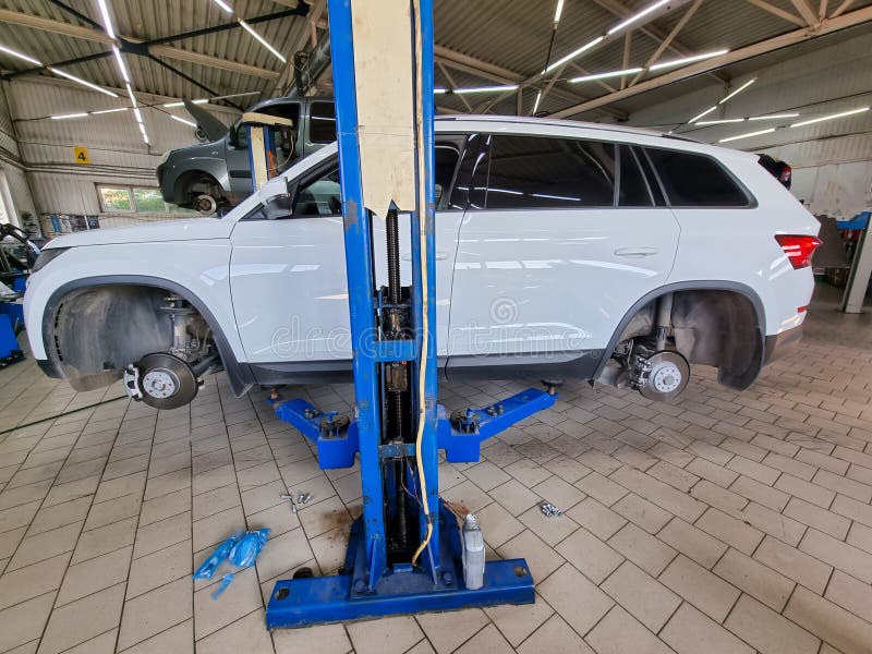 Auto Repair Shop, Tire Fitting, Car Wheel Replacement Stock Photo ...