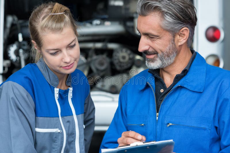 Auto repair shop workers stock image. Image of assistant - 188229133