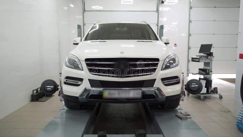 Auto Service Center Performs Precise Wheel Alignment on Luxury Vehicle ...