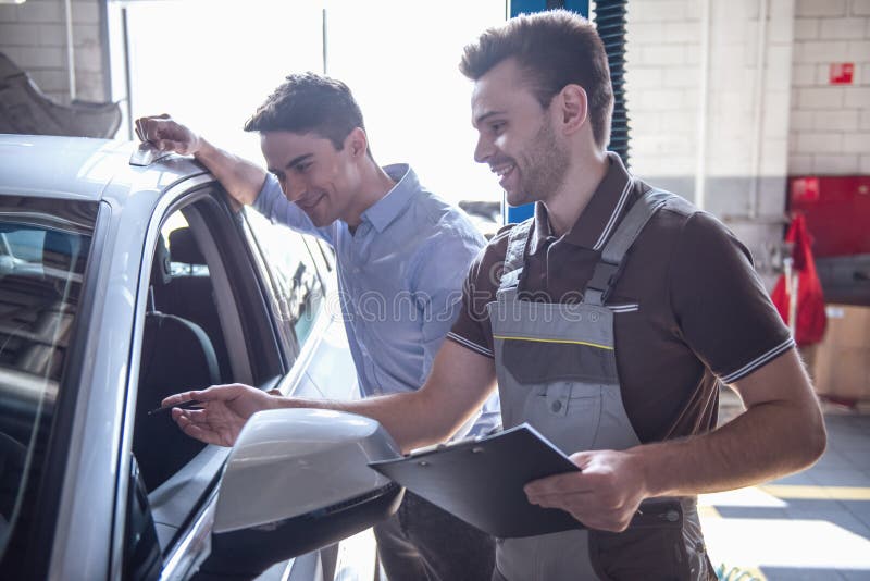At the auto service stock image. Image of document, labor - 293955289