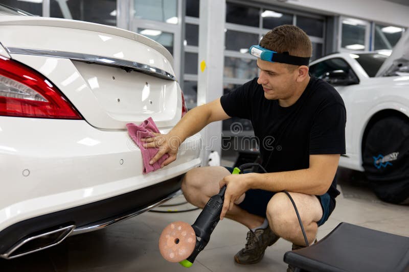 Auto Service Worker Polishing Car in Garage Workshop Stock Photo ...